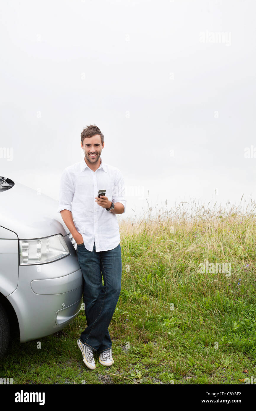 portrait of young man with mobile phone Stock Photo - Alamy
