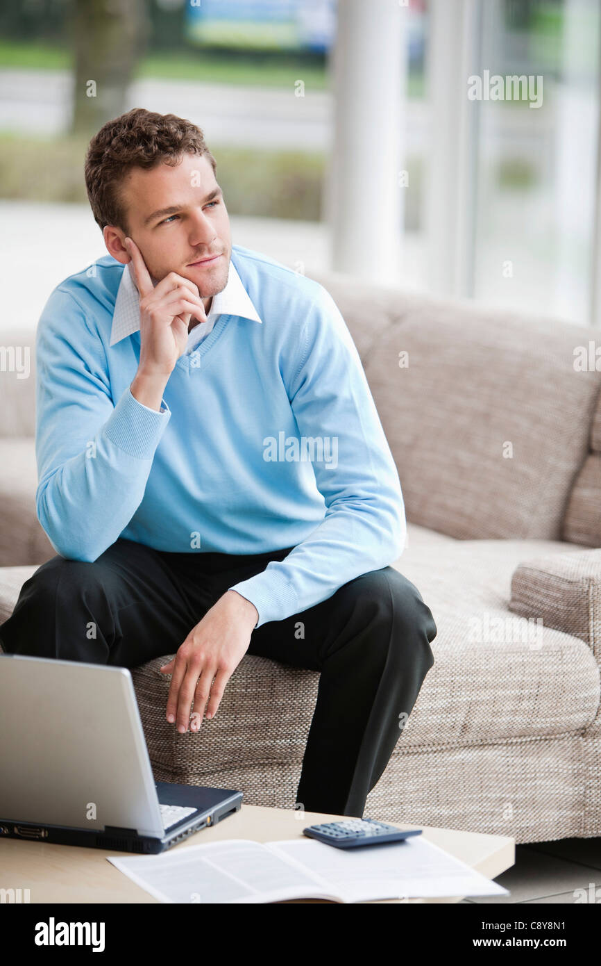 portrait of young man with laptop computer at home Stock Photo - Alamy