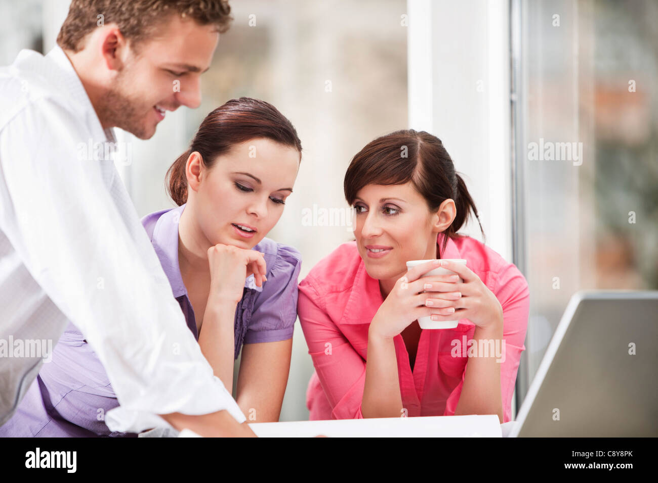 three business people having discussion Stock Photo - Alamy