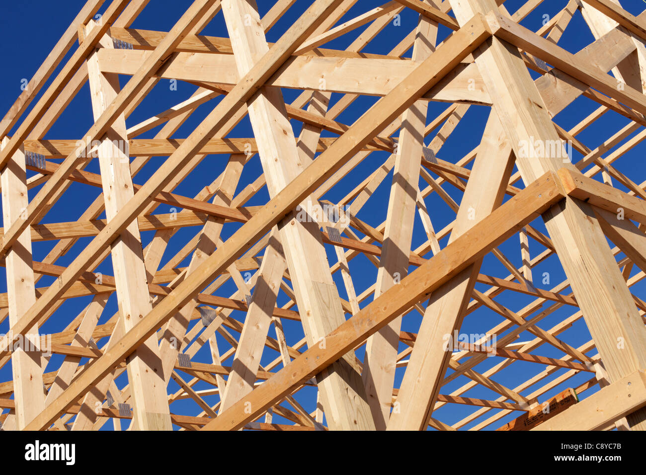 Wood framing detail of a large structure being built Stock Photo - Alamy