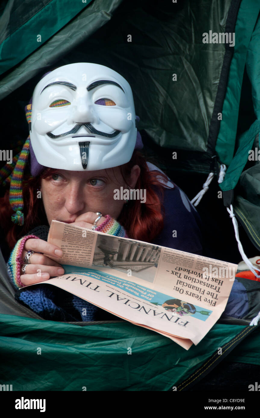 Occupy London at St Paul's . A protester wearing a Guy Fawkes mask in a ...