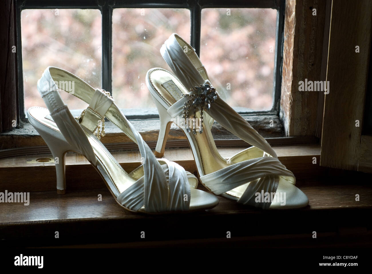 Wedding shoes on window sill waiting to be worn Stock Photo - Alamy