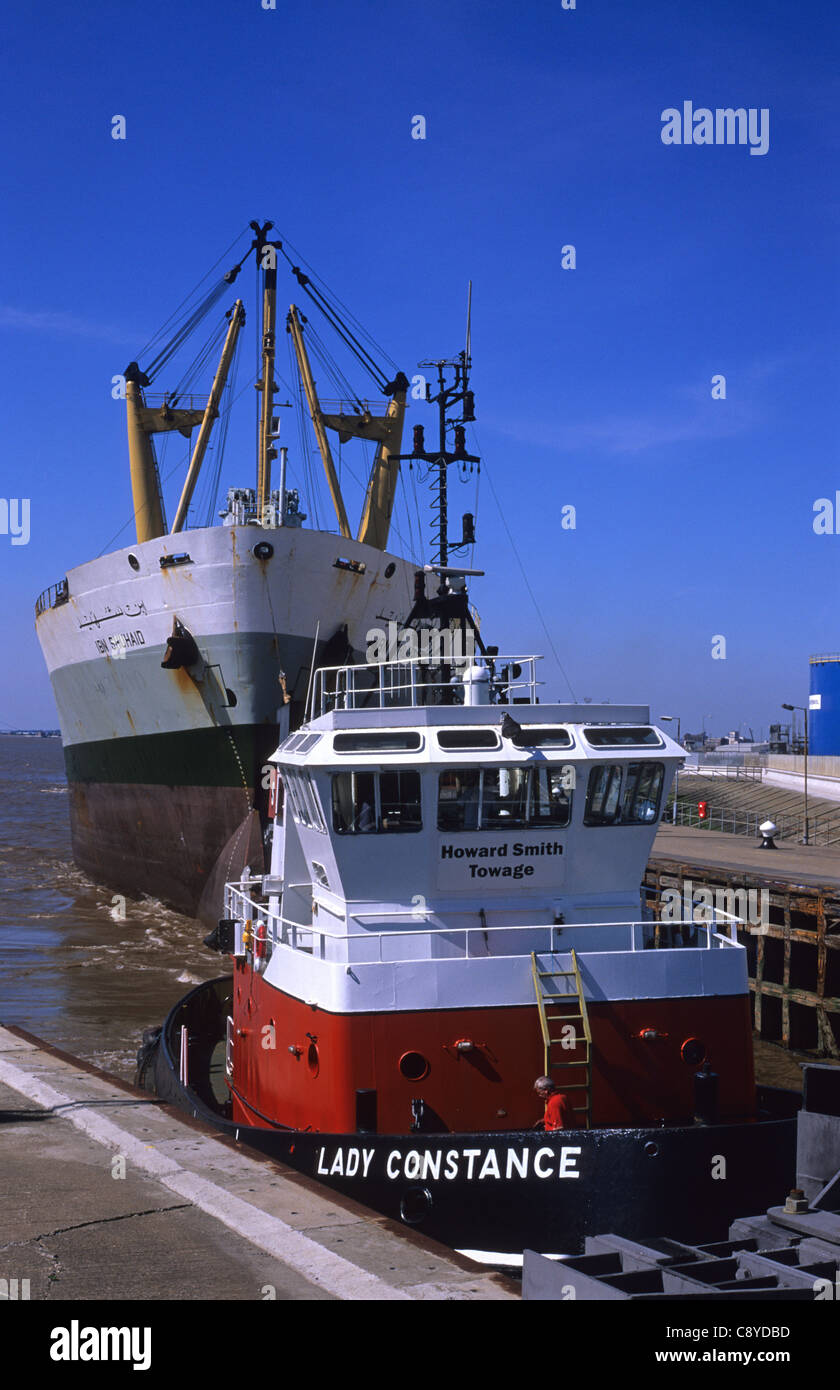 tug boat towing freighter into lock at the port of hull docks hull uk ...