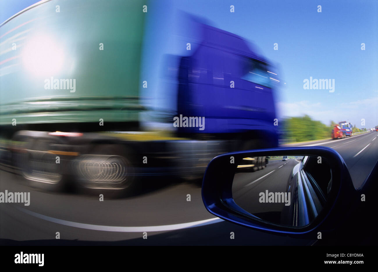 car overtaking lorry travelling on the a1/m1 motorway near leeds ...