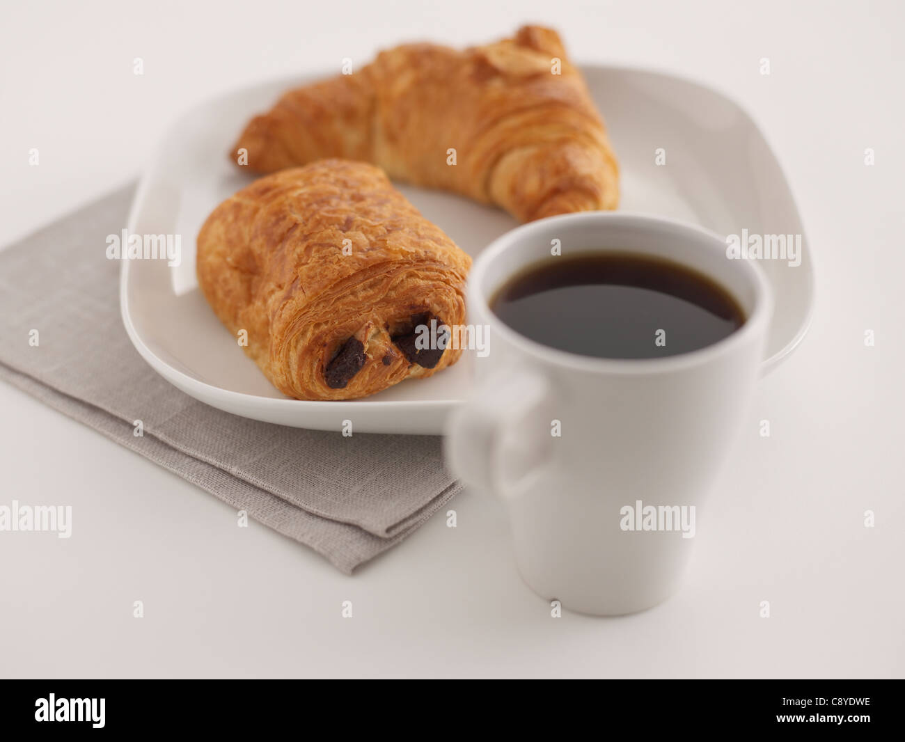 black coffee with pain au chocolat Stock Photo - Alamy