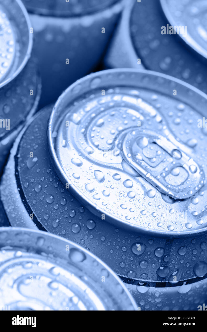 Blue drinking cans with water drops close up Stock Photo - Alamy
