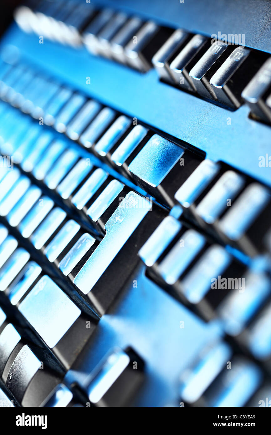 Computer keyboard close-up in blue light. Shallow DOF! Stock Photo - Alamy