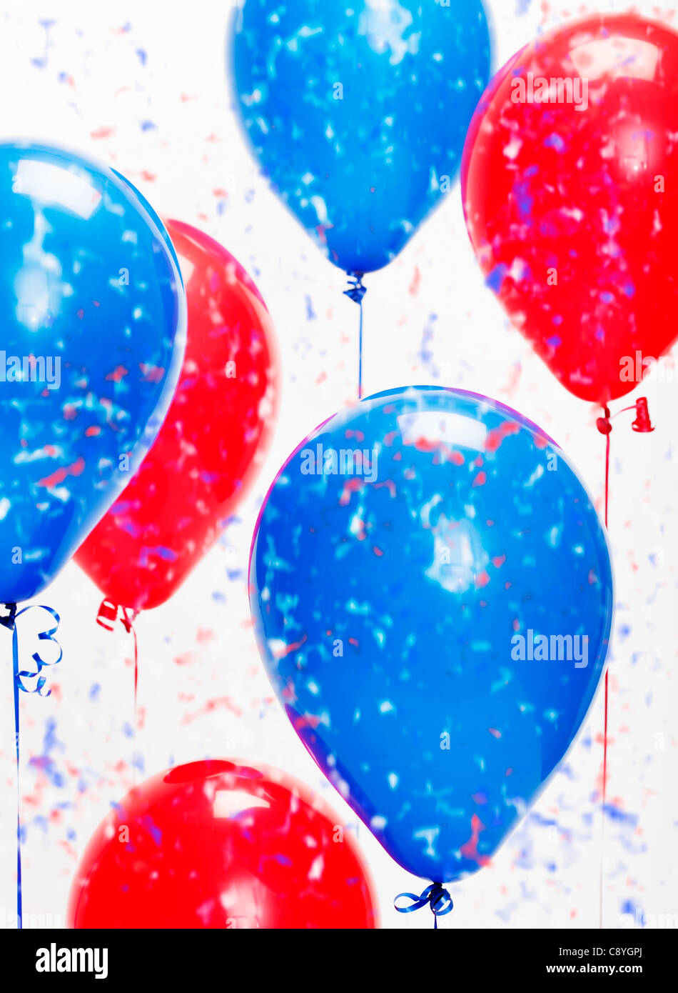 Studio shot of blue and red balloons Stock Photo - Alamy