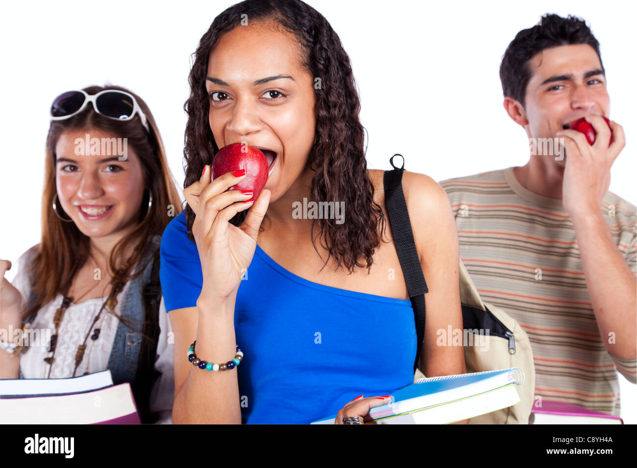 Three happy students holding books (isolated on white Stock Photo - Alamy
