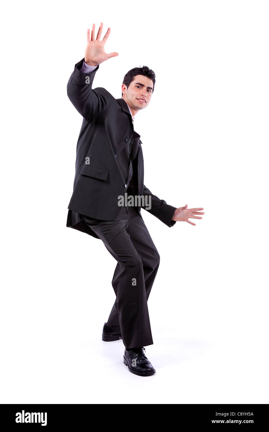 Scared businessman in a falling position (isolated on white Stock Photo ...