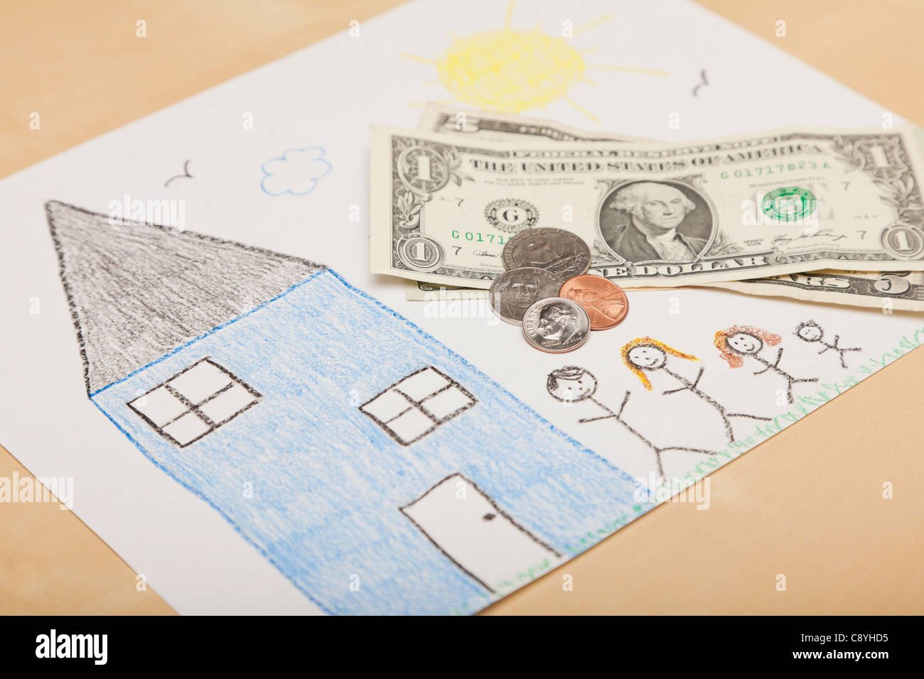 Studio shot of child's drawing of house and family and American ...