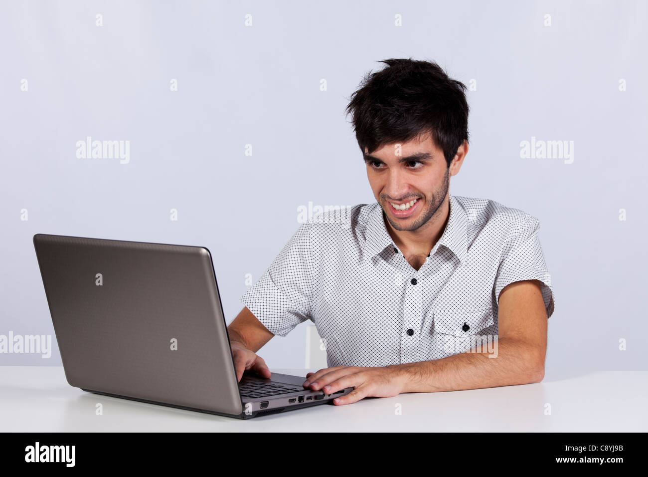 young man working with his laptop computer Stock Photo - Alamy