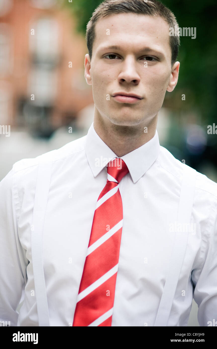 Portrait of a young man from Russia, dressed in a preppy style going ...