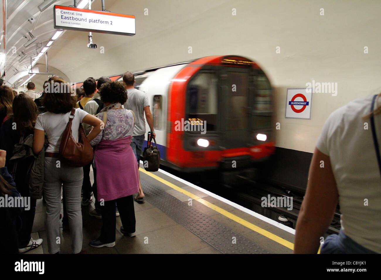 Commuters at Queensway underground tube station - London Stock Photo ...