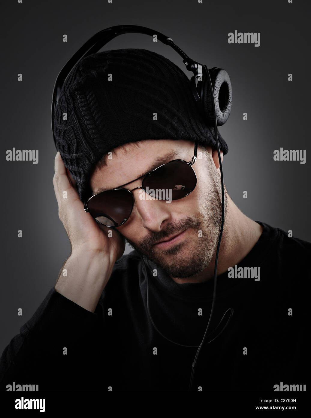 DJ with headphones Stock Photo - Alamy