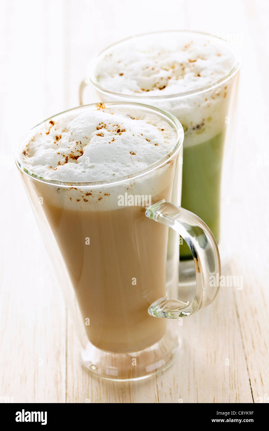Two specialty tea latte beverages of chai and matcha teas Stock Photo ...