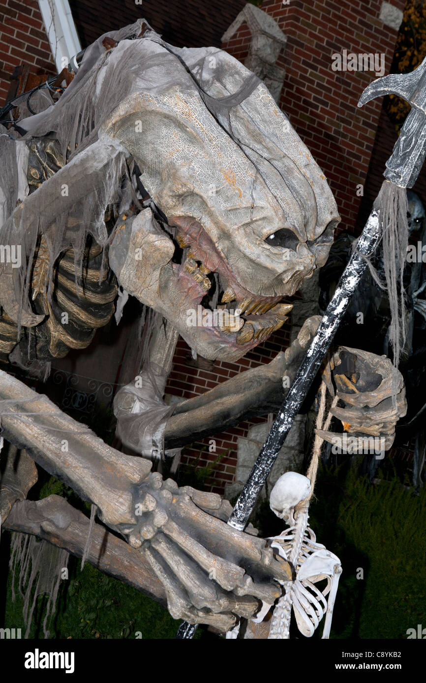 Monster with human skeletal victim Stock Photo - Alamy