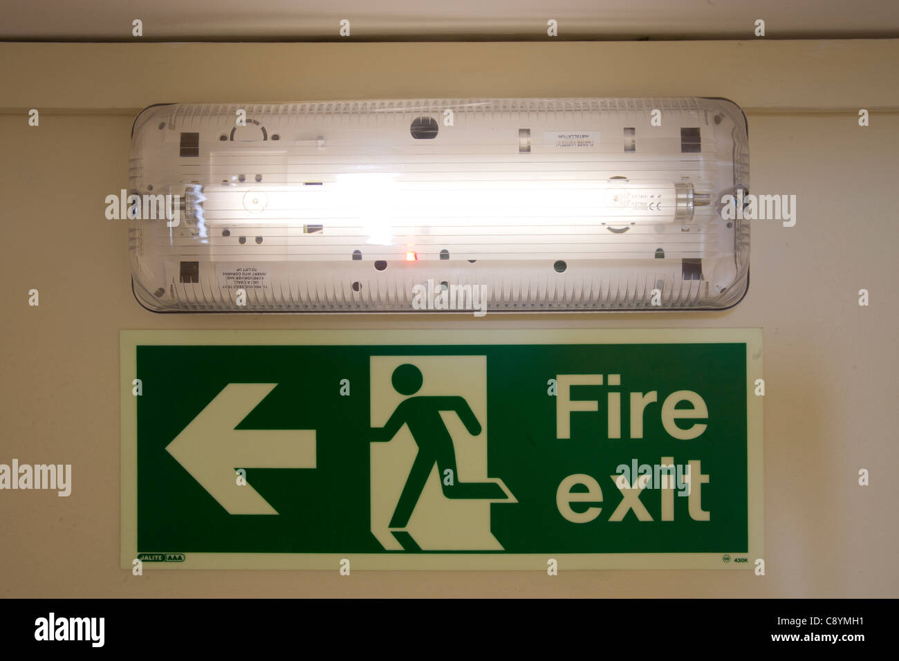 Emergency Exit Light with an illuminous fire exit sign Stock Photo - Alamy