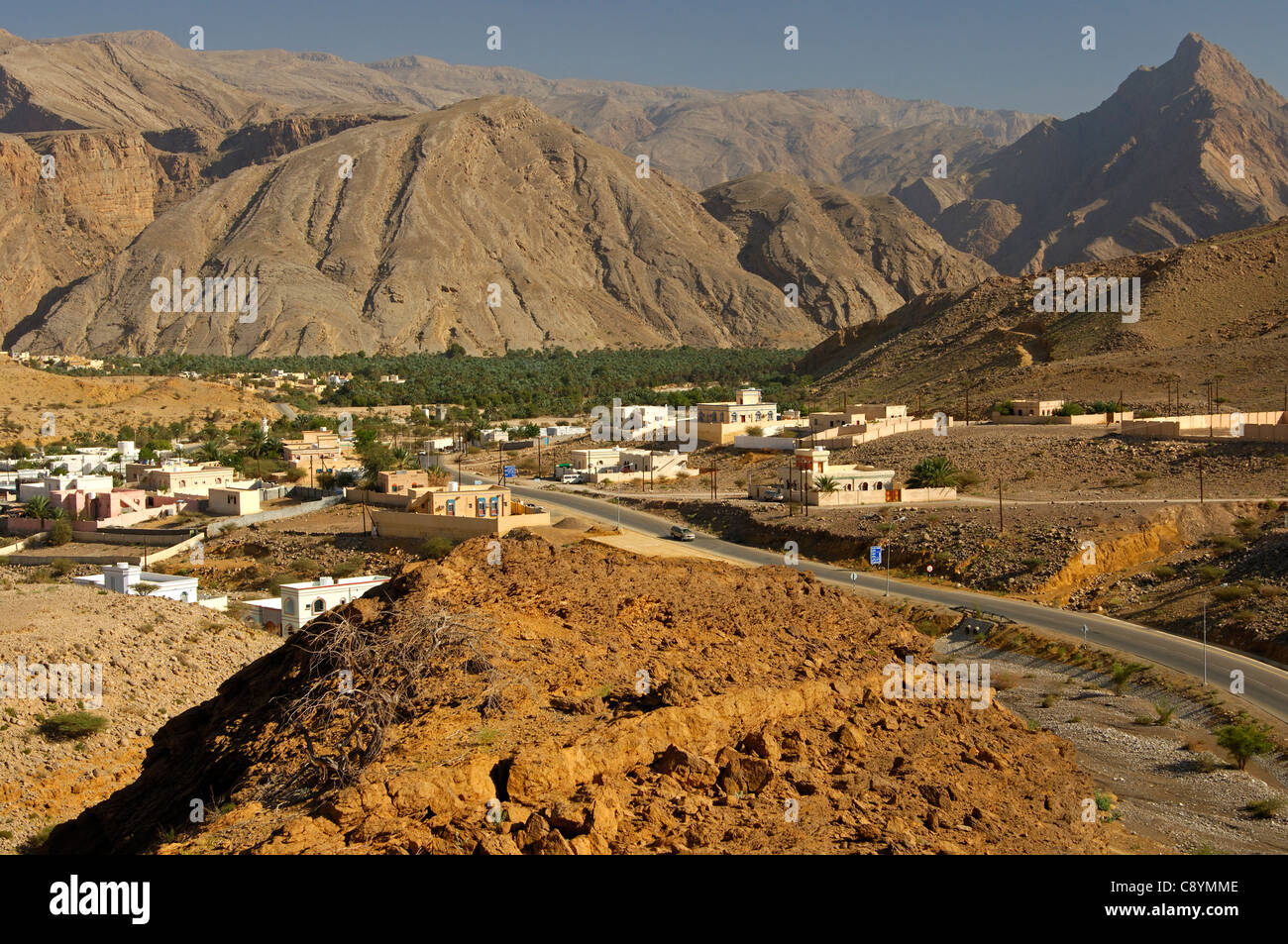 Village at the foot of the barren mountain range of the Al Hajar ...