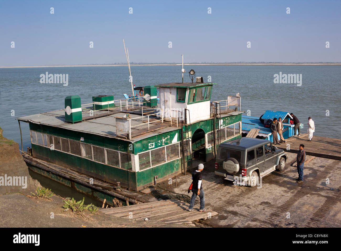India, Assam, Jorhat, car driving onto ferry crossing Brahmaputra River ...