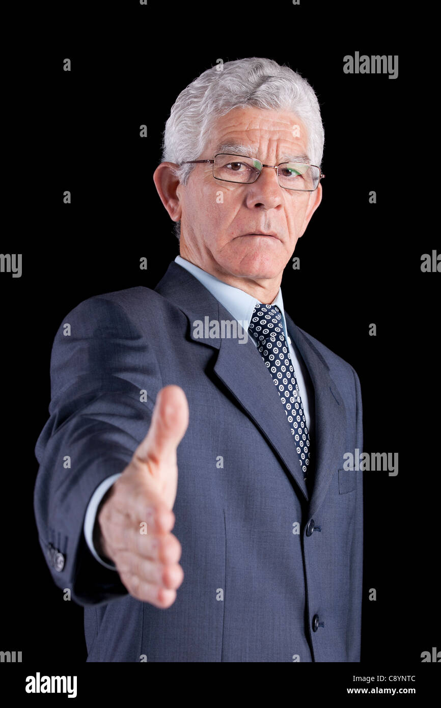 senior businessman making a deal with you (isolated on black Stock ...