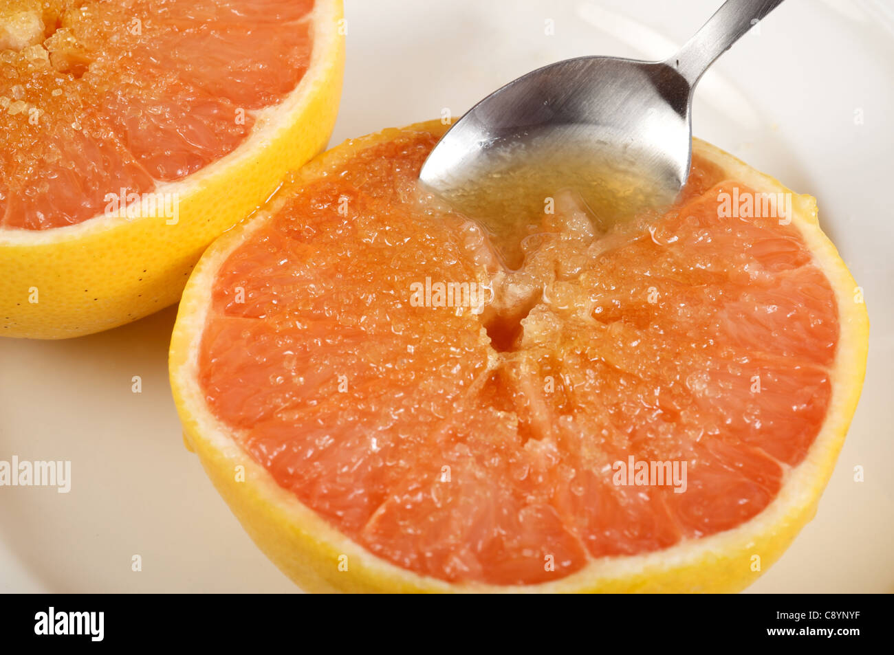 Pink grapefruit with brown sugar Stock Photo - Alamy