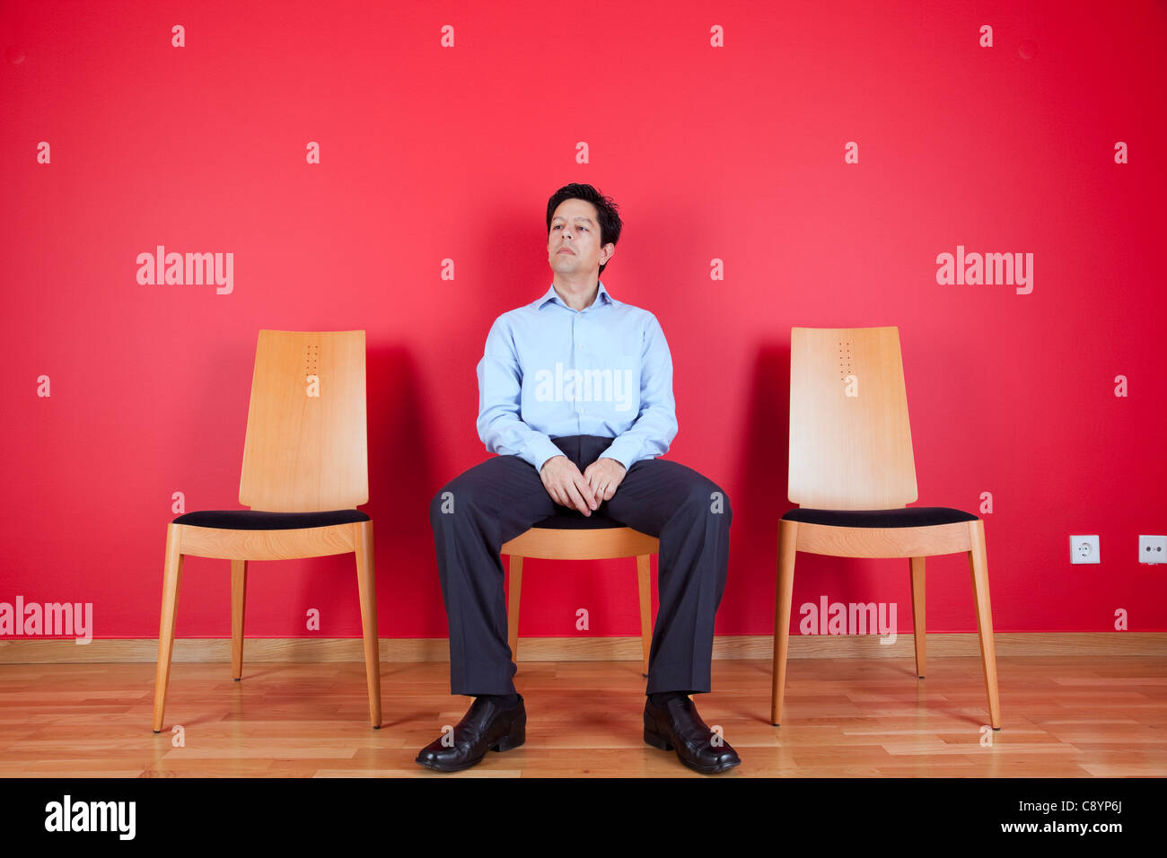 Business man standing next chair hi-res stock photography and images ...