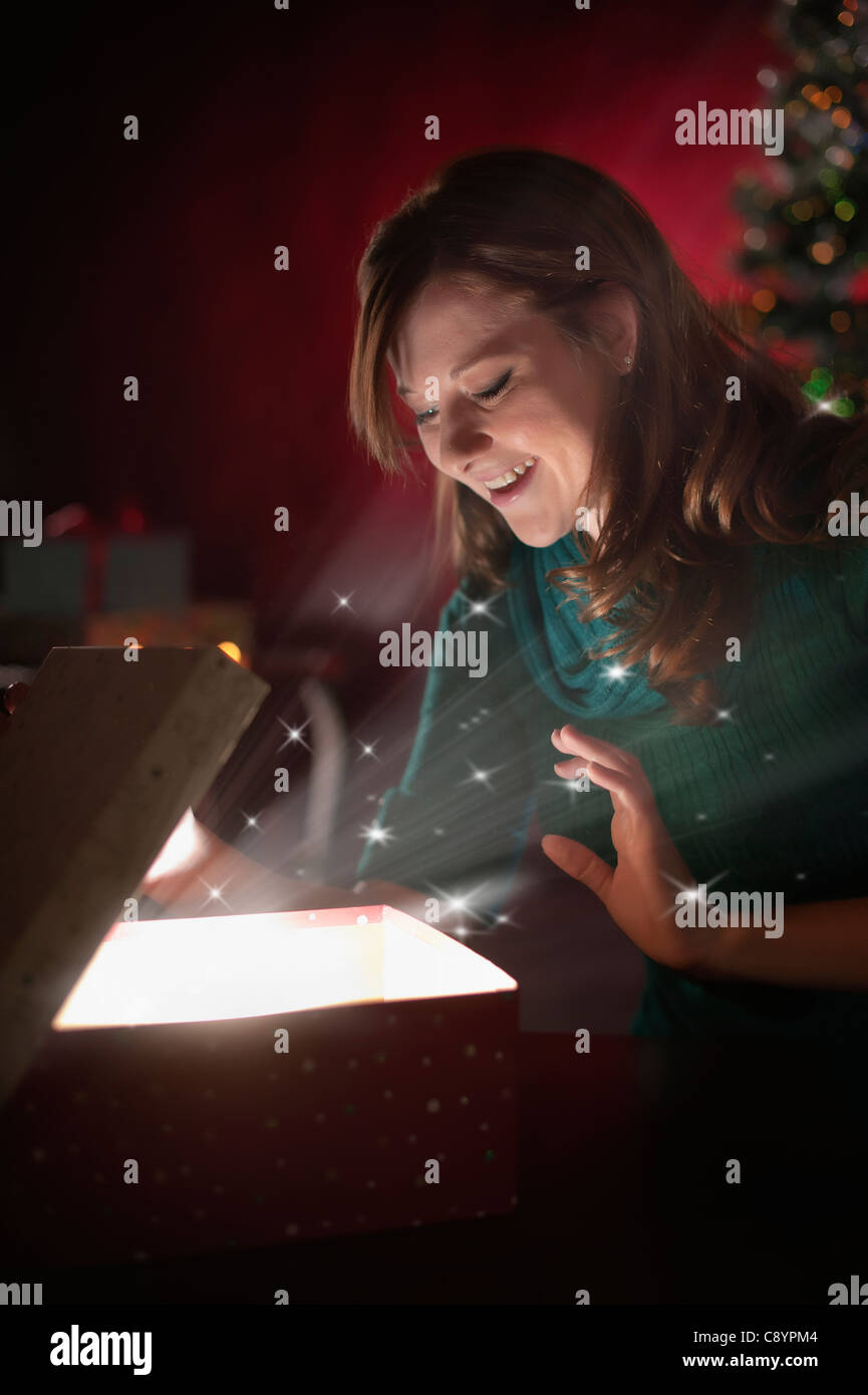 Surprised young woman opening gifts hi-res stock photography and images ...