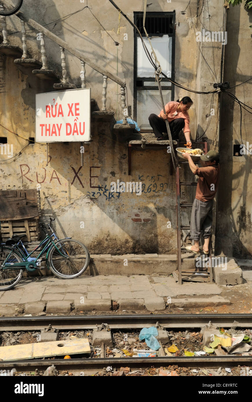 Asia, Vietnam, Hanoi. Railway track leading through Hanoi's centre ...