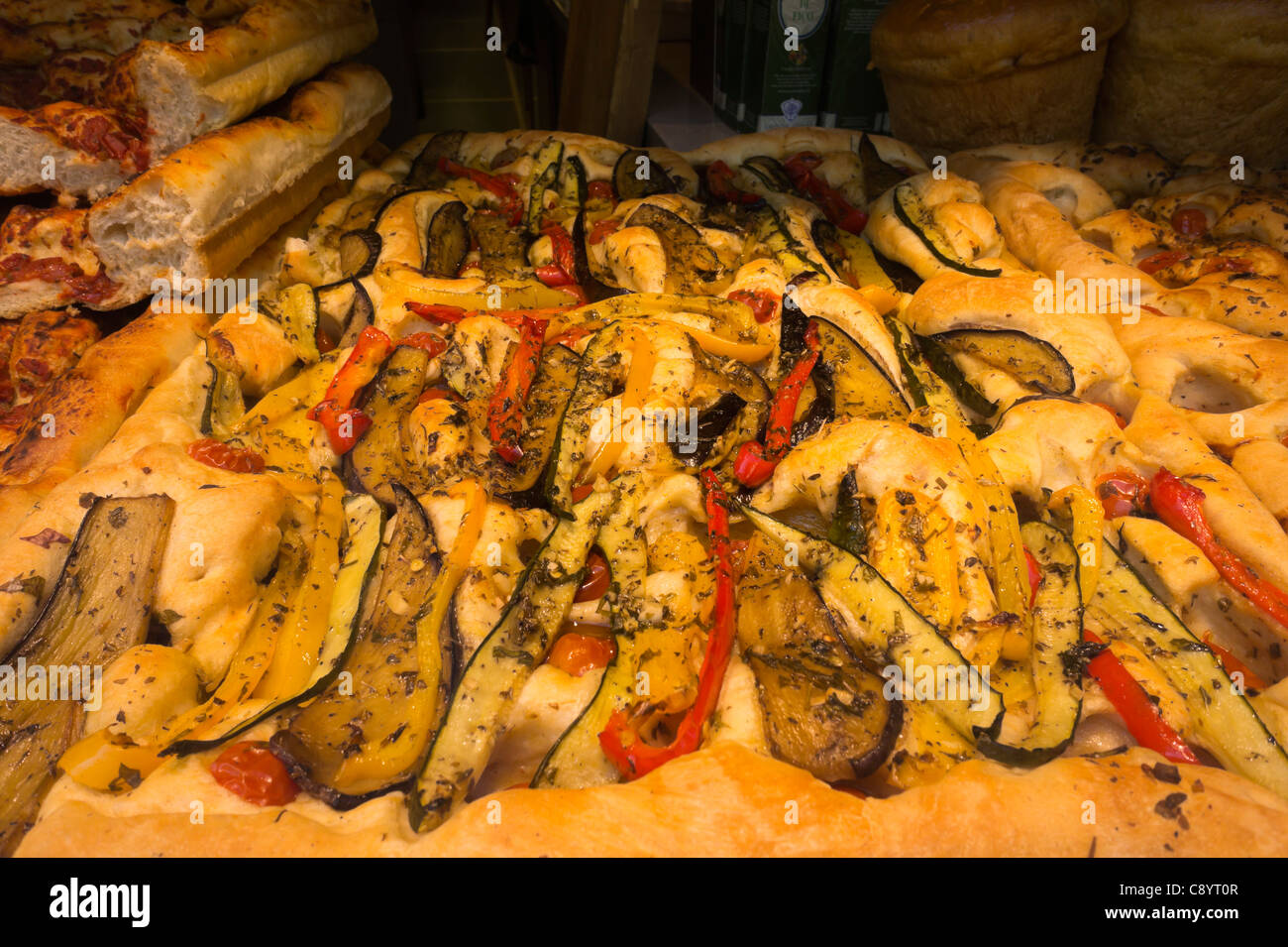 Ancona Italy - local breads with pizza type toppings in a bakery window ...