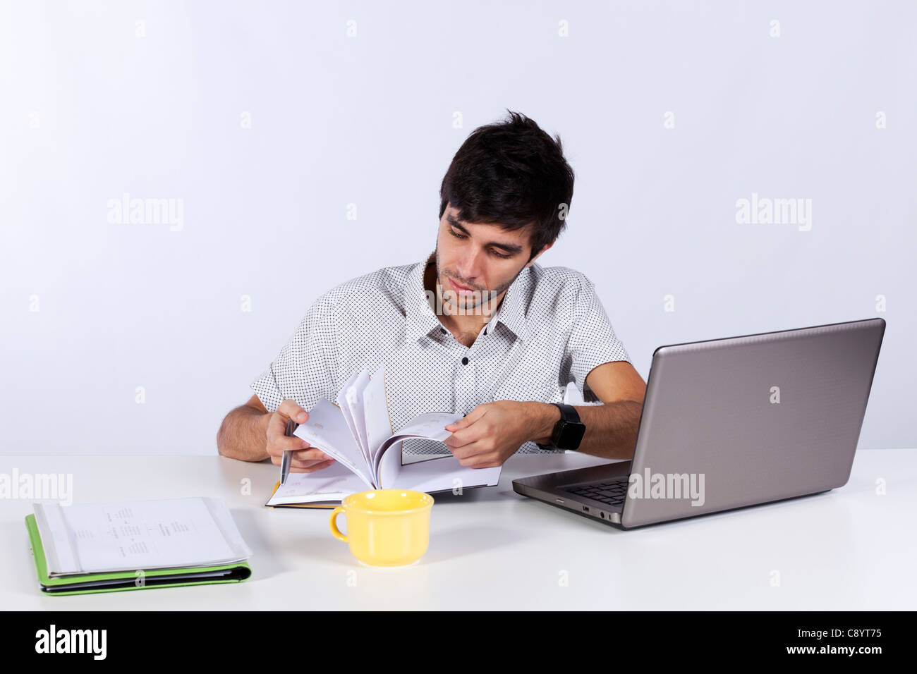 young man working with his laptop computer Stock Photo - Alamy