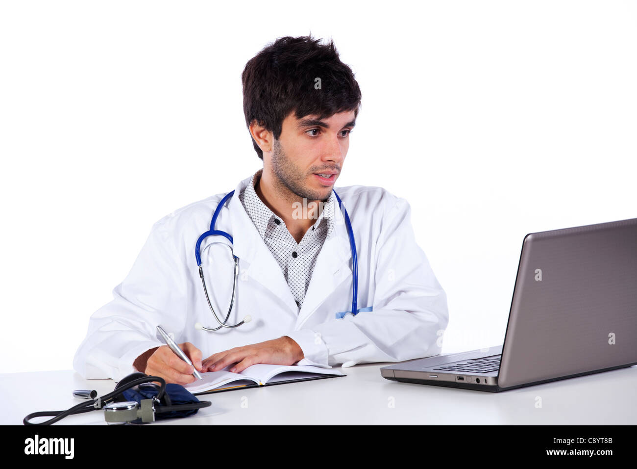 happy young doctor working at his desk (isolated on white Stock Photo ...