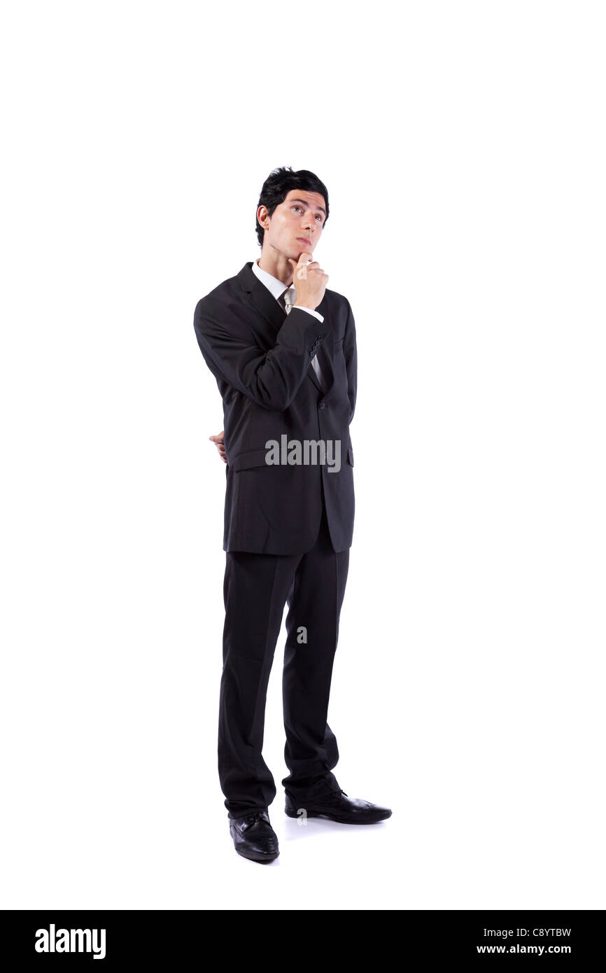 Young businessman thinking and looking up (isolated on white Stock ...