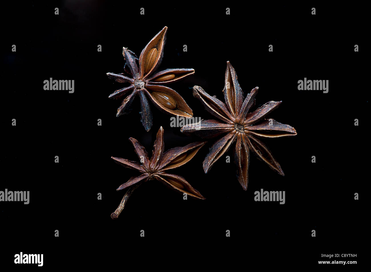 aerial view of two aniseed seeds on a black surface, color image Stock ...