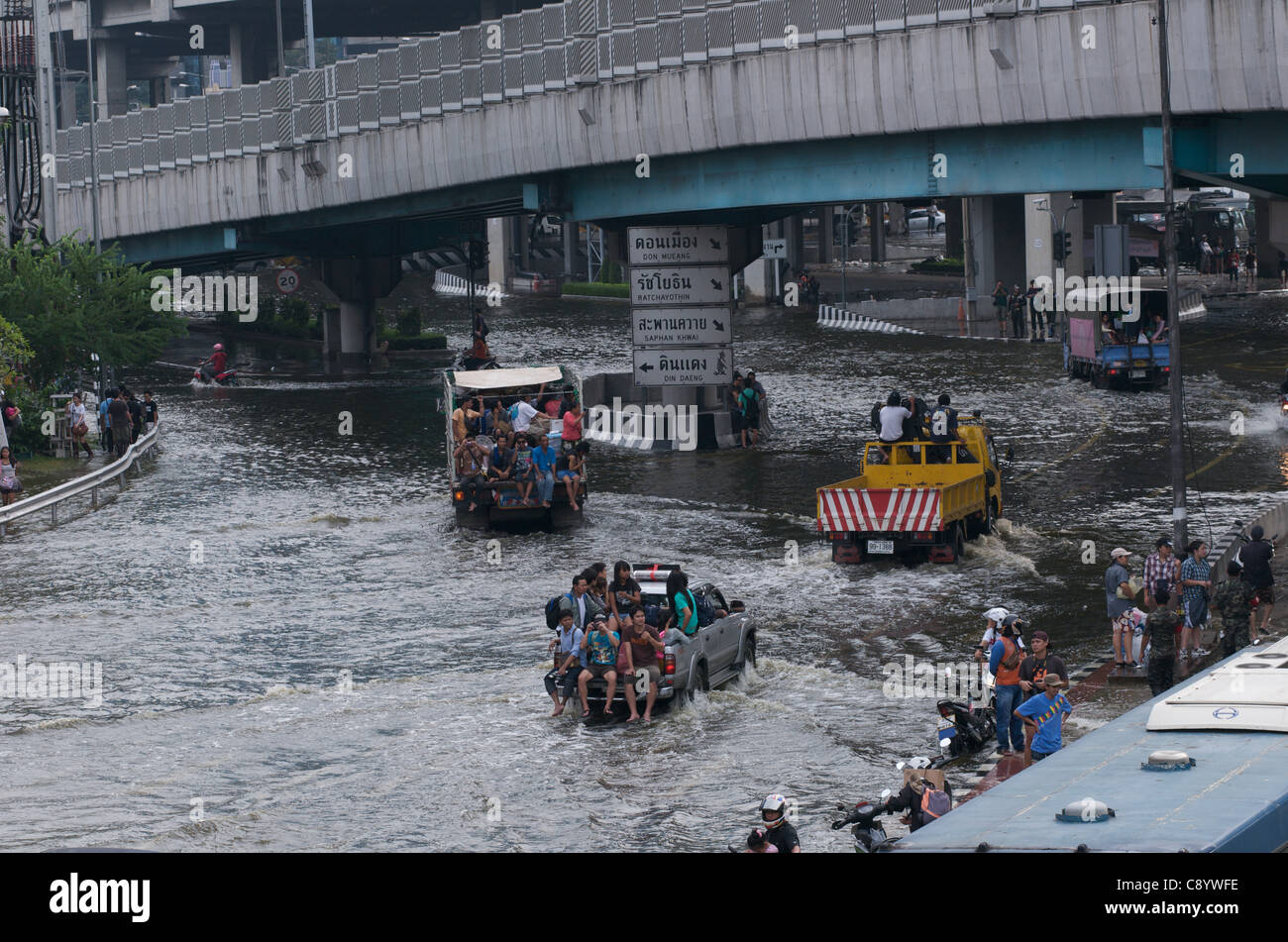 Bangkok residents flee flood. Lat Phrao, Bangkok, Thailand on Saturday ...