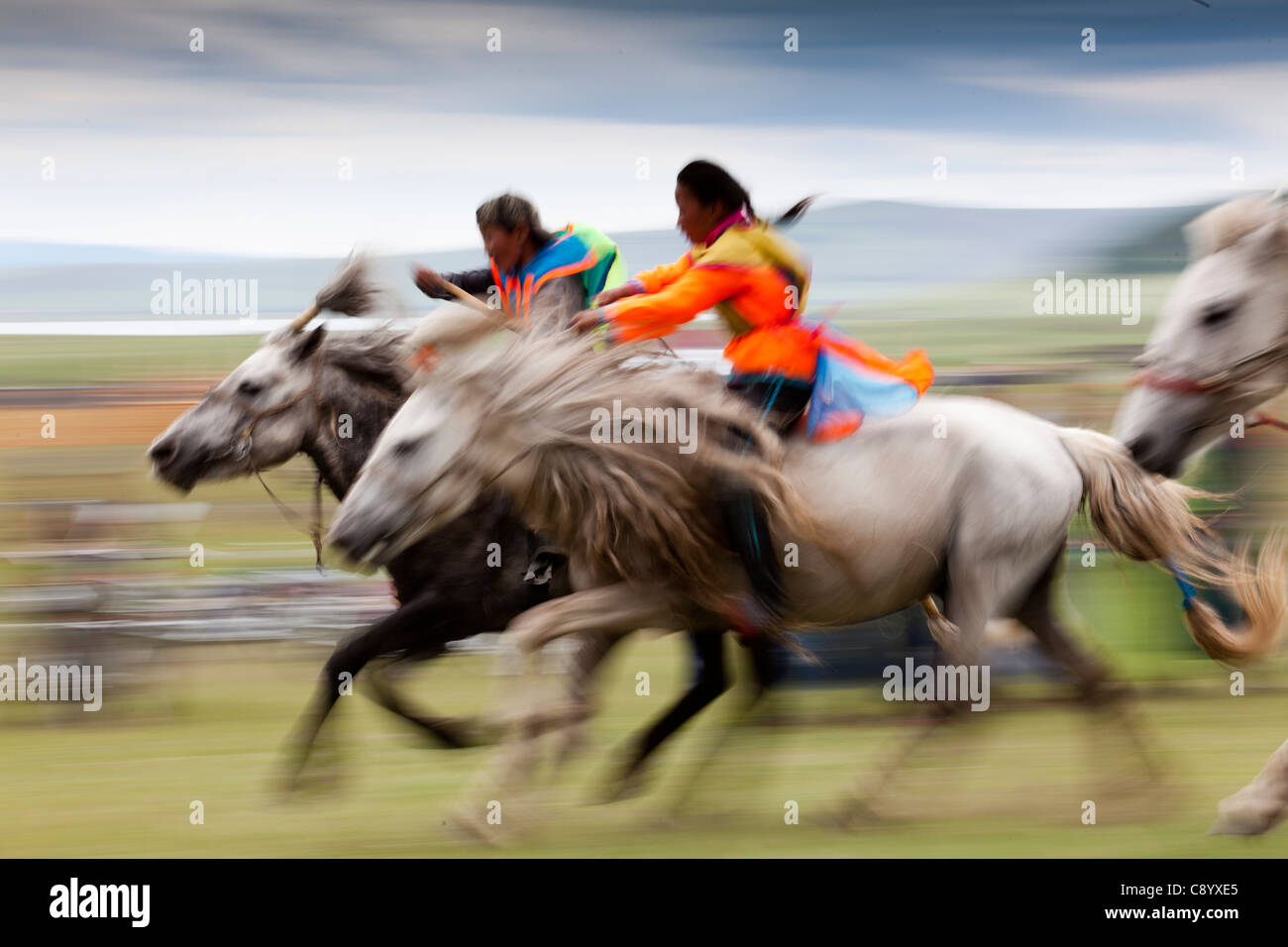 Mongolian child horse racing at Naadam festival in Tsagaannuur ...