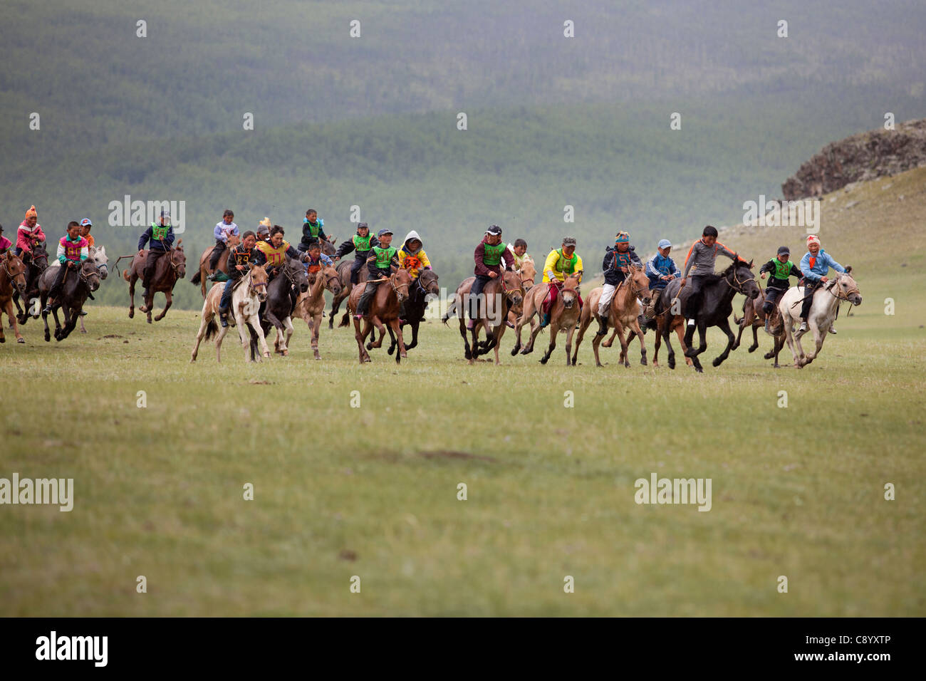 Mongolian child horse racing at Naadam festival in Tsagaannuur ...