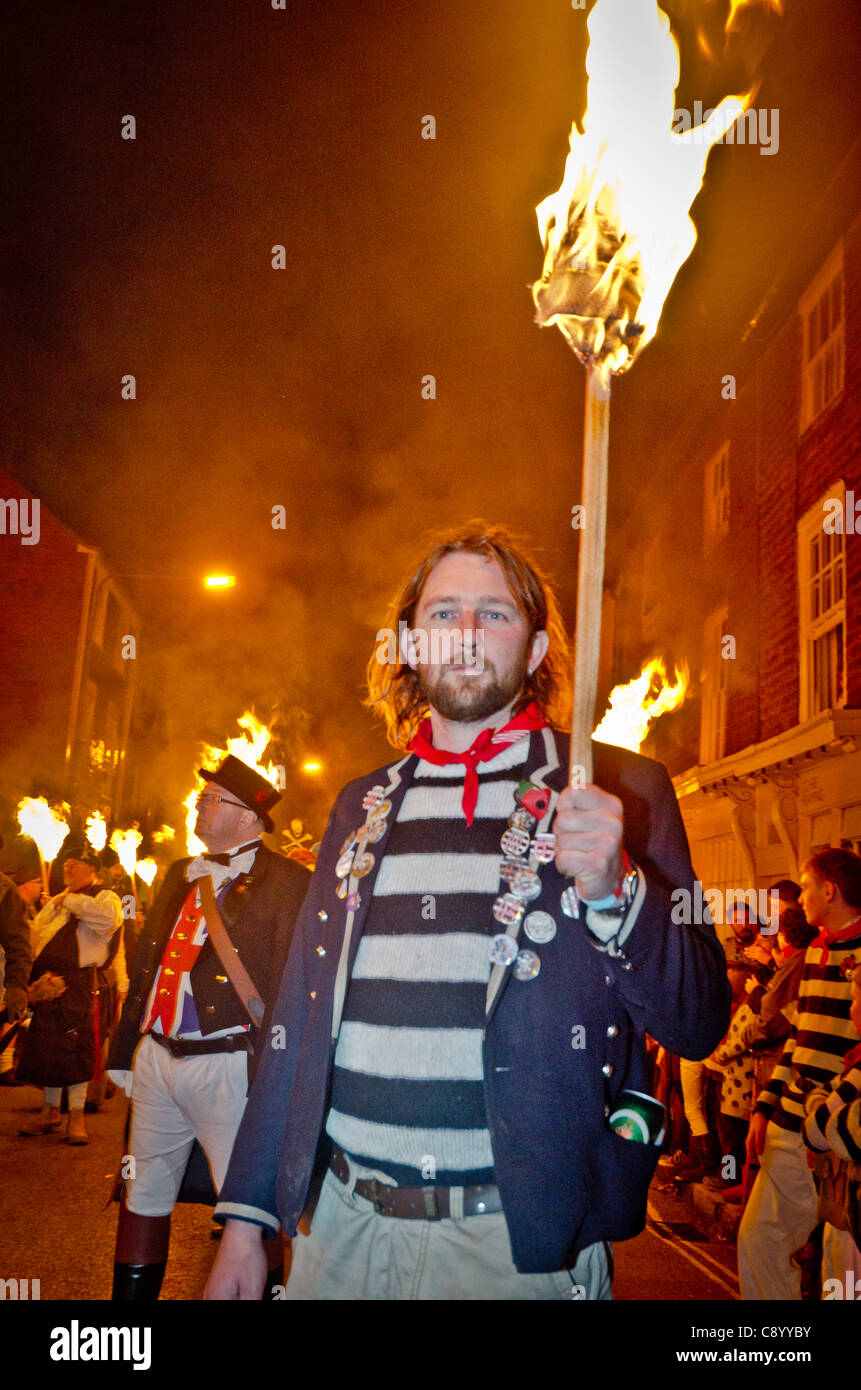 A member of Cliffe Bonfire Society parades through the town of Lewes ...