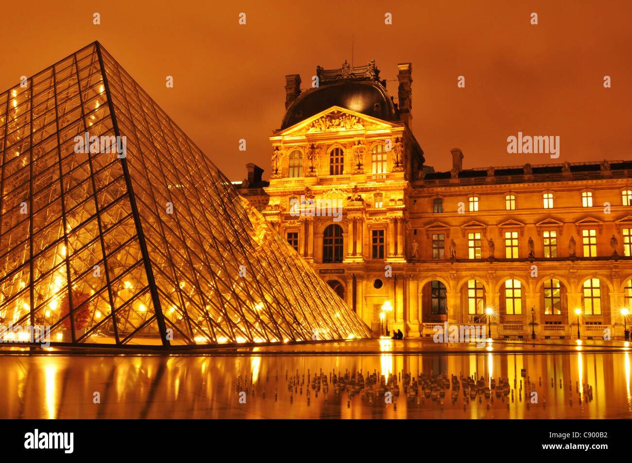 Louvre Museum in Paris at night Stock Photo - Alamy