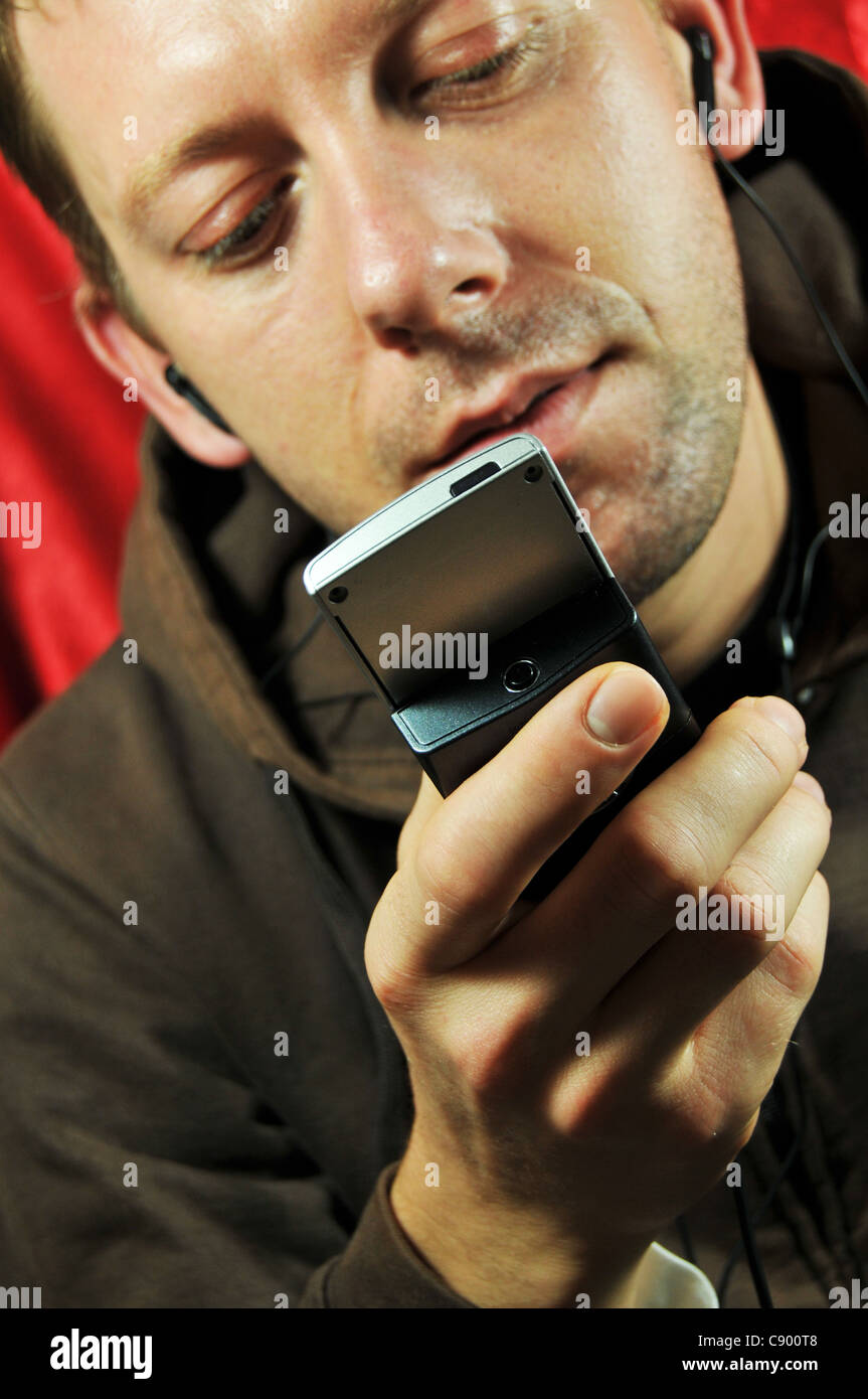 Man holding mobile phone Stock Photo - Alamy