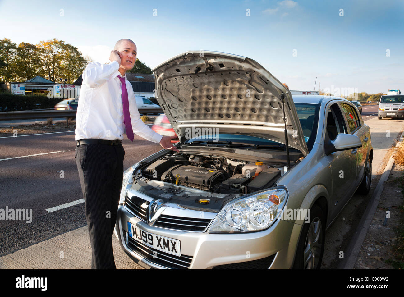 man with broken down car along motorway Stock Photo - Alamy