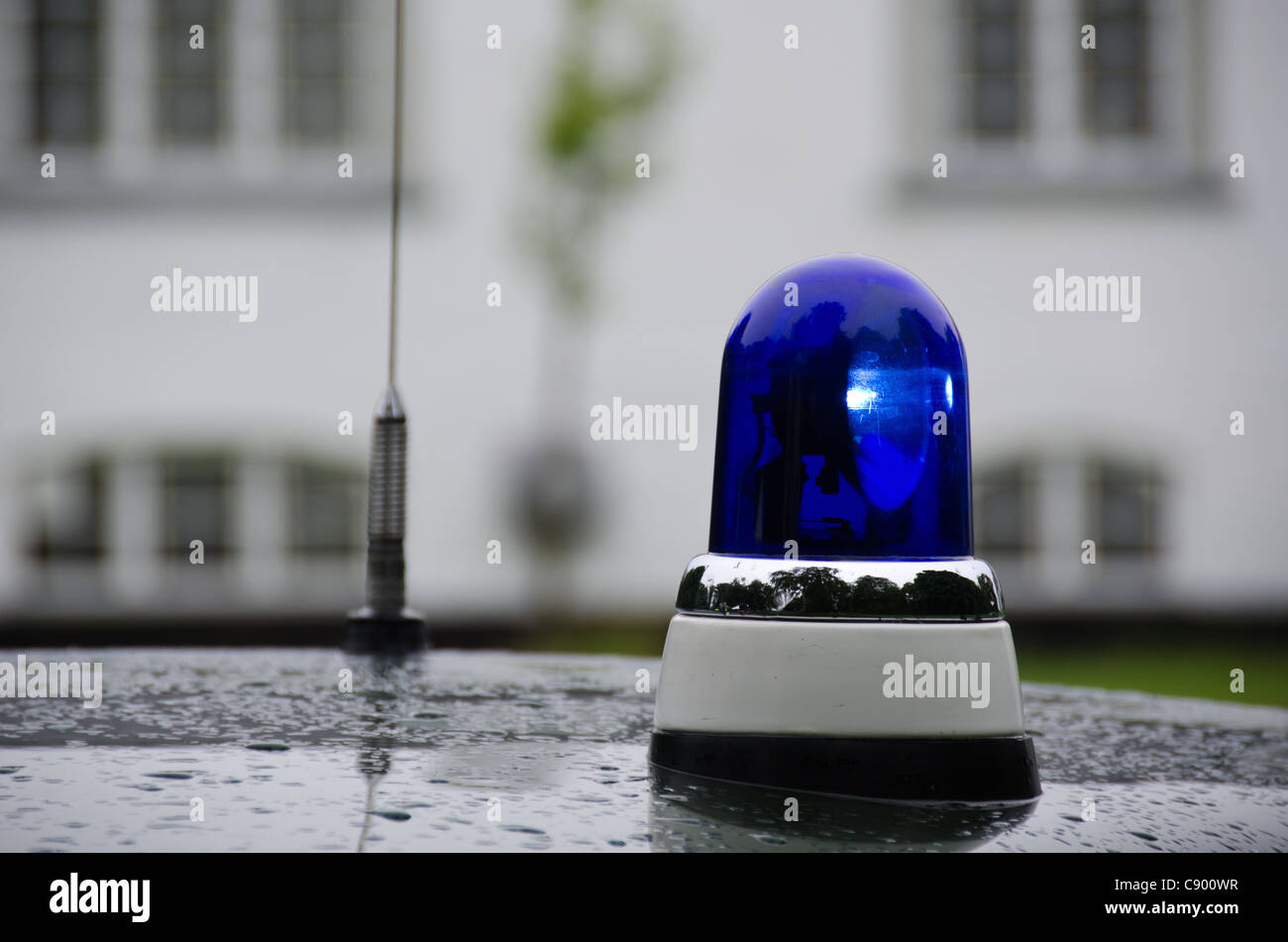 Blue police light shining on an old police car in Denmark Stock Photo ...