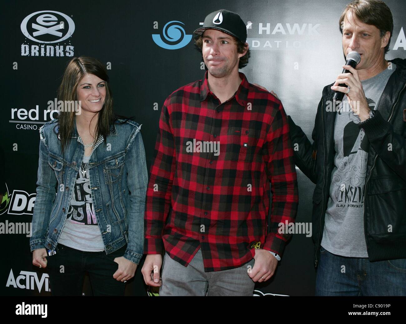 Lyn-Z Adams Hawkins, Travis Pastrana, Tony Hawk at a public appearance ...
