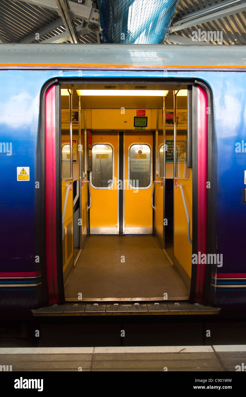 First Capital Connect rail carriage doors open Stock Photo - Alamy