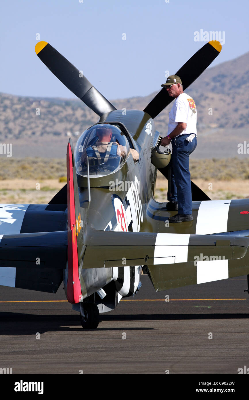 Crewmember stands on the wing of the Unlimited Air Racer "Speedball ...