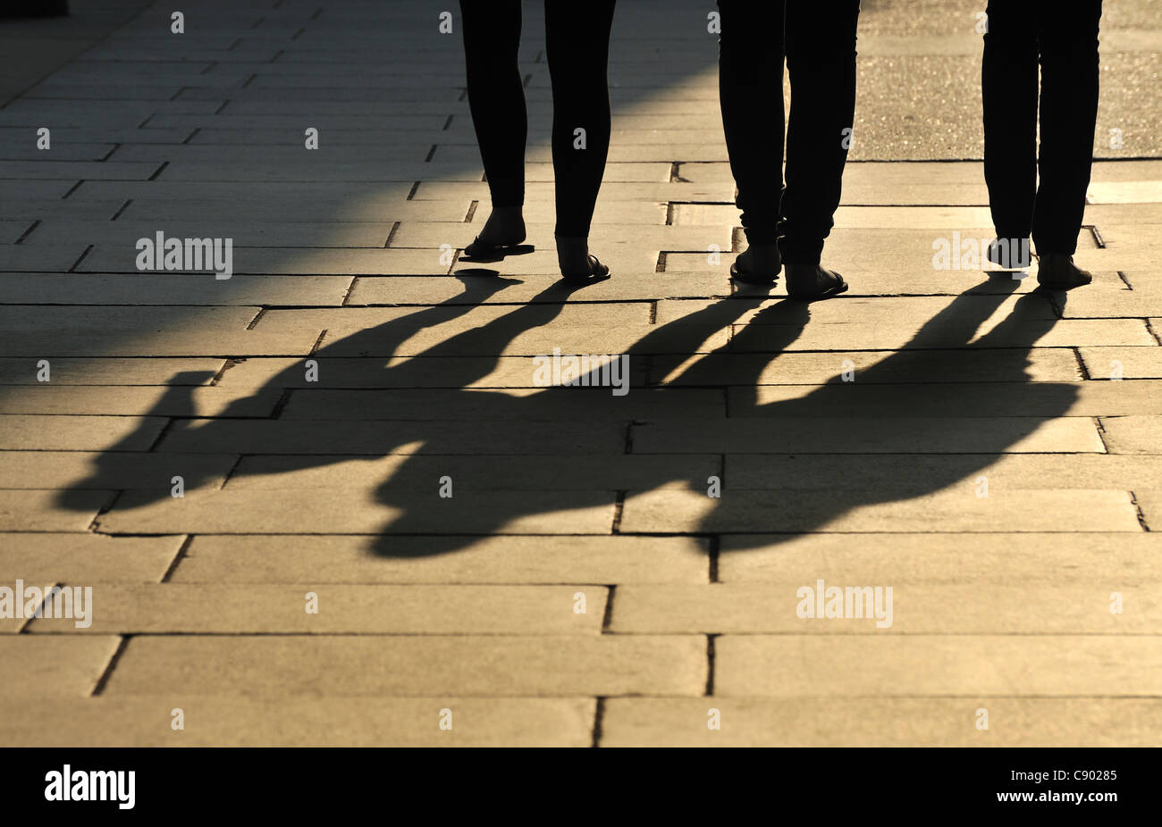 Three people legs shadow hi-res stock photography and images - Alamy