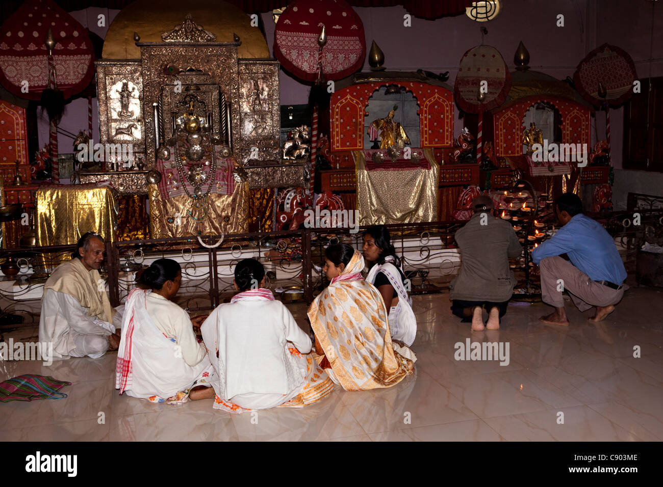 India, Assam, Majuli Island, Satra (monastery) temple, worshipperswith ...