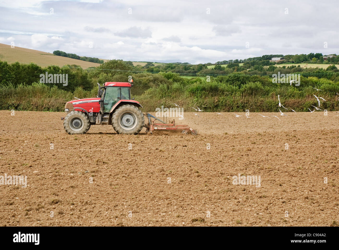UK farming - tractorin field in Cornwall Stock Photo - Alamy
