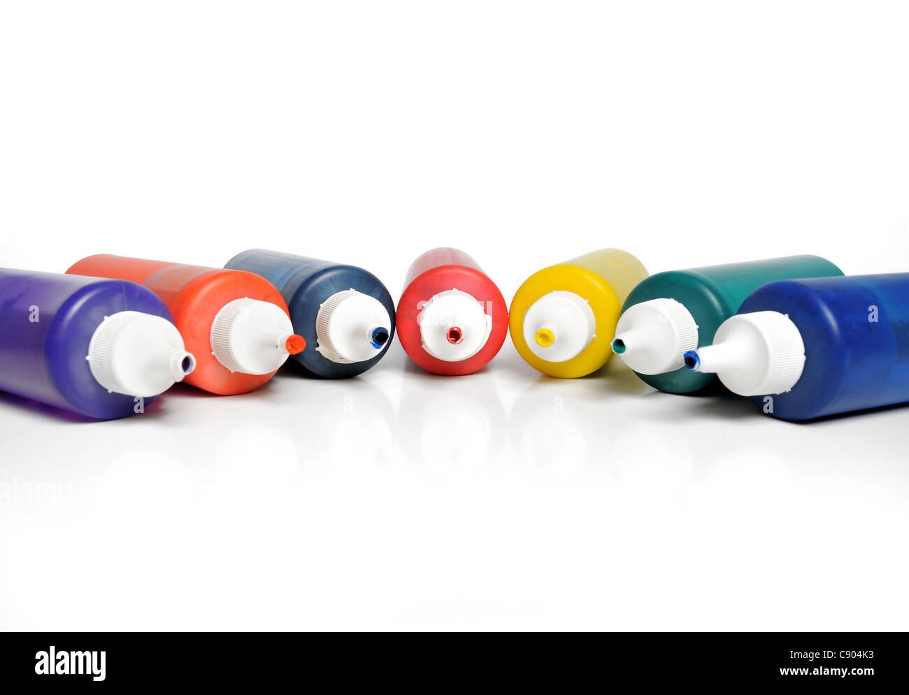 Group of color tubes over white background Stock Photo - Alamy