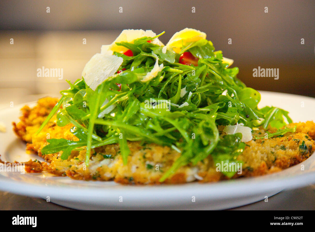 Arugula and fish dish Stock Photo - Alamy